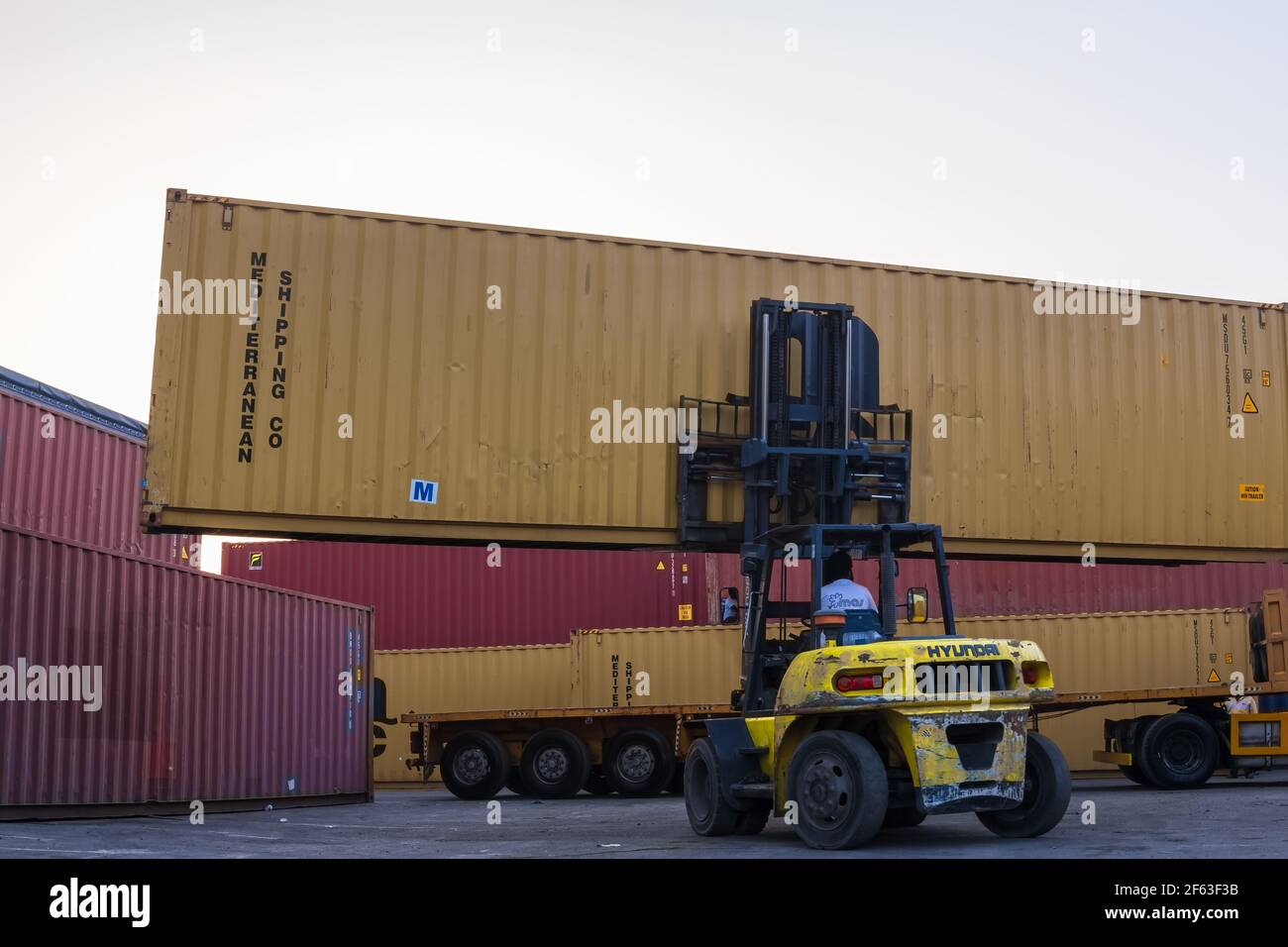 Stacked cargo containers in storage area of freight sea port terminal ...
