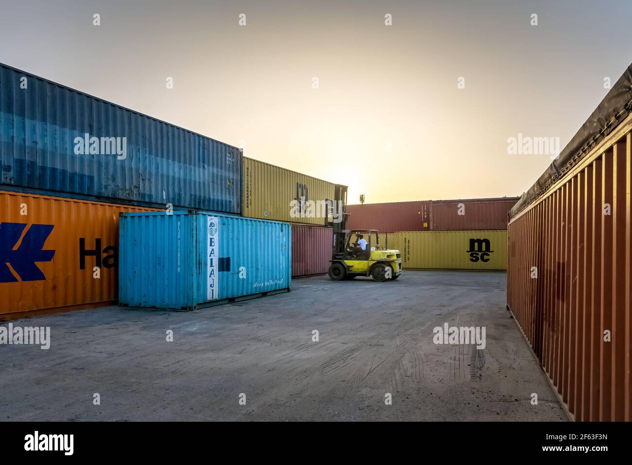 Stacked cargo containers in storage area of freight sea port terminal ...