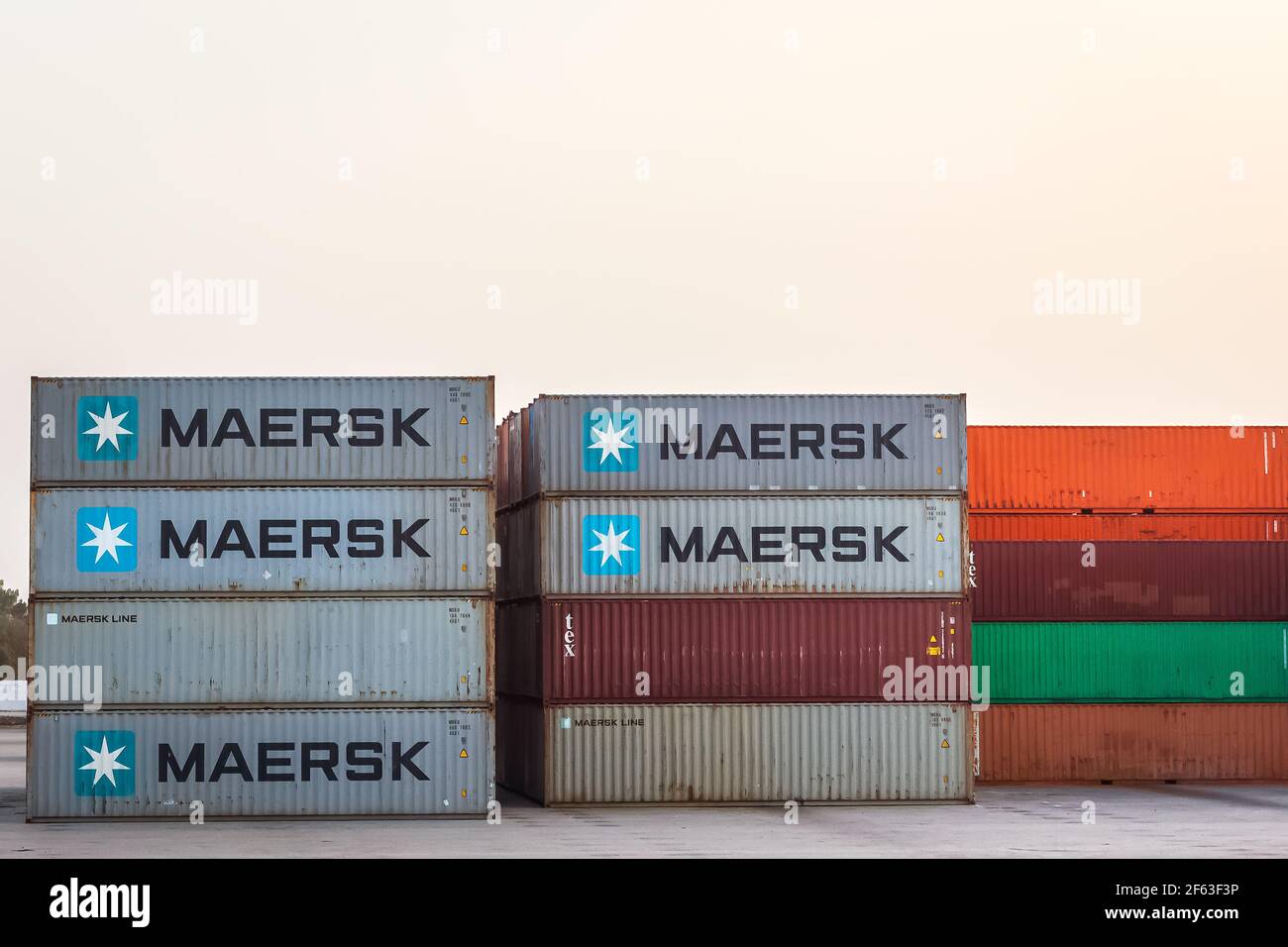 Stacked cargo containers in storage area of freight sea port terminal ...