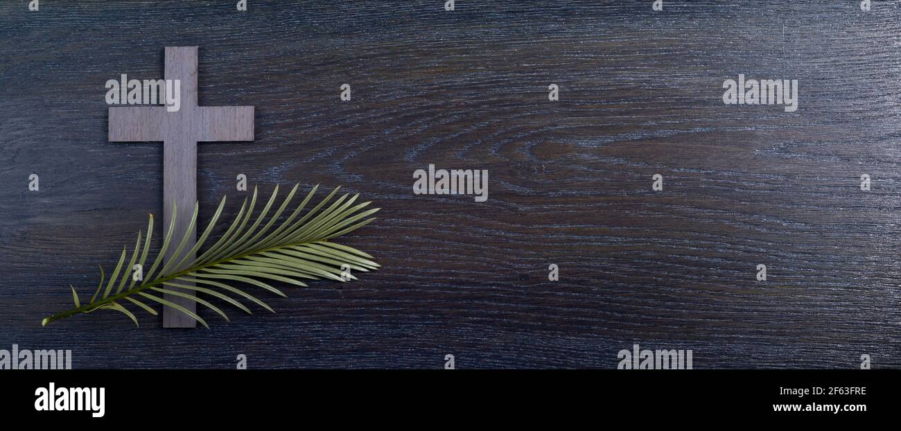 Palm sunday background. Cross and palm on wooden background Stock Photo ...