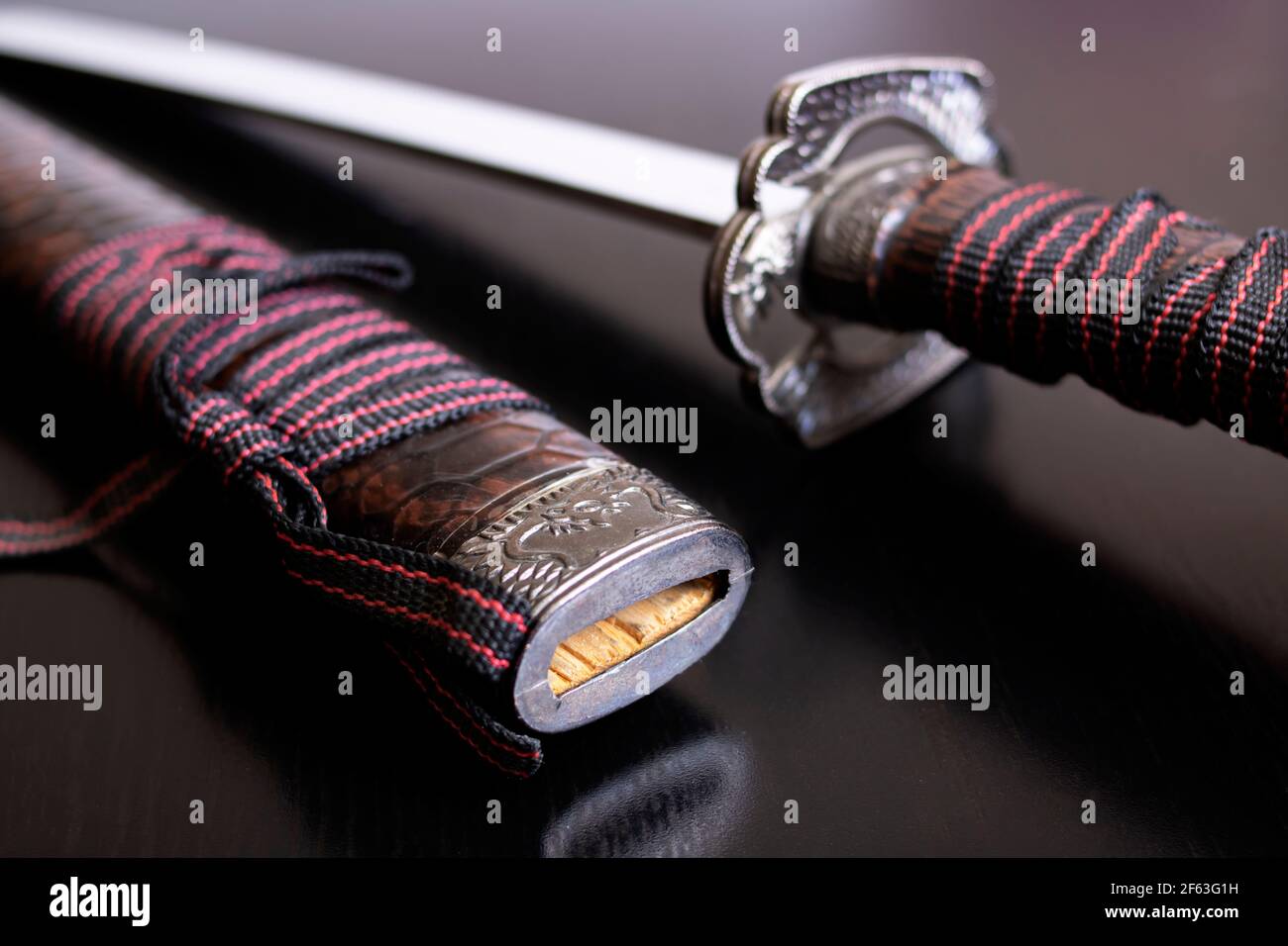 Samurai sword and scabbard on wooden background close up Stock Photo ...