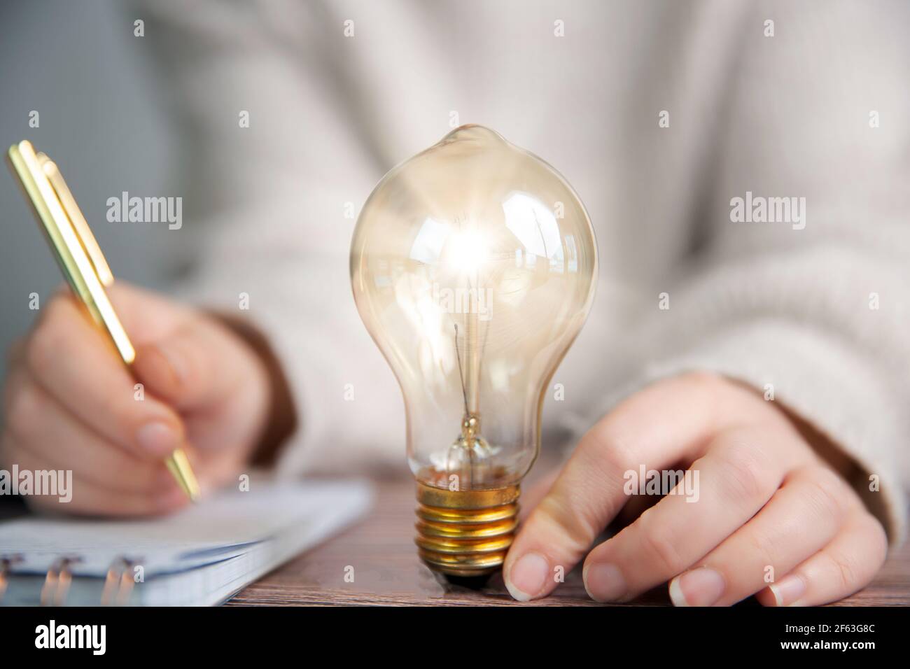 Business person writing notes,ideas,creative brainstorming with shining ...