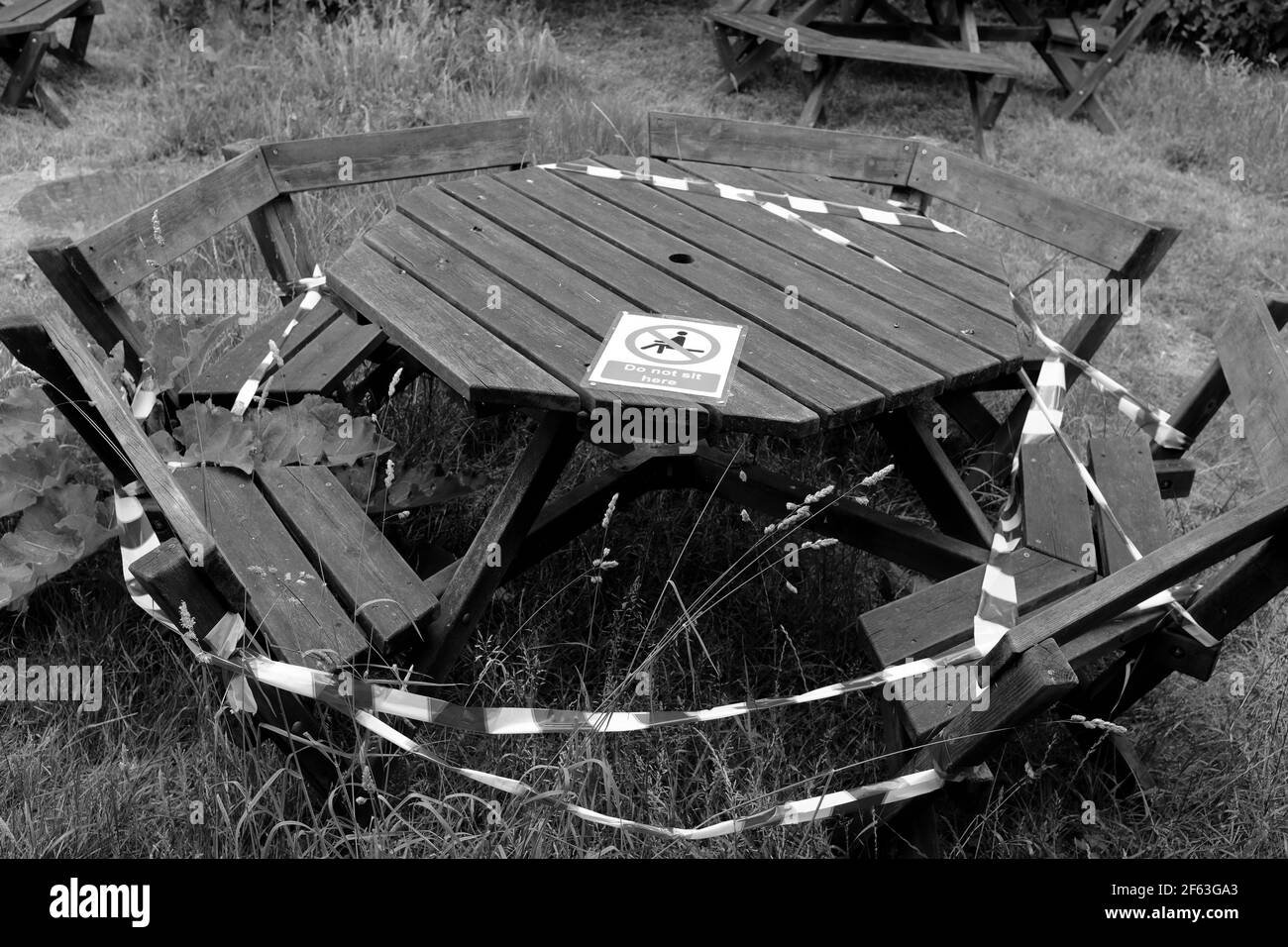 Taped up chairs in lockdown Stock Photo - Alamy
