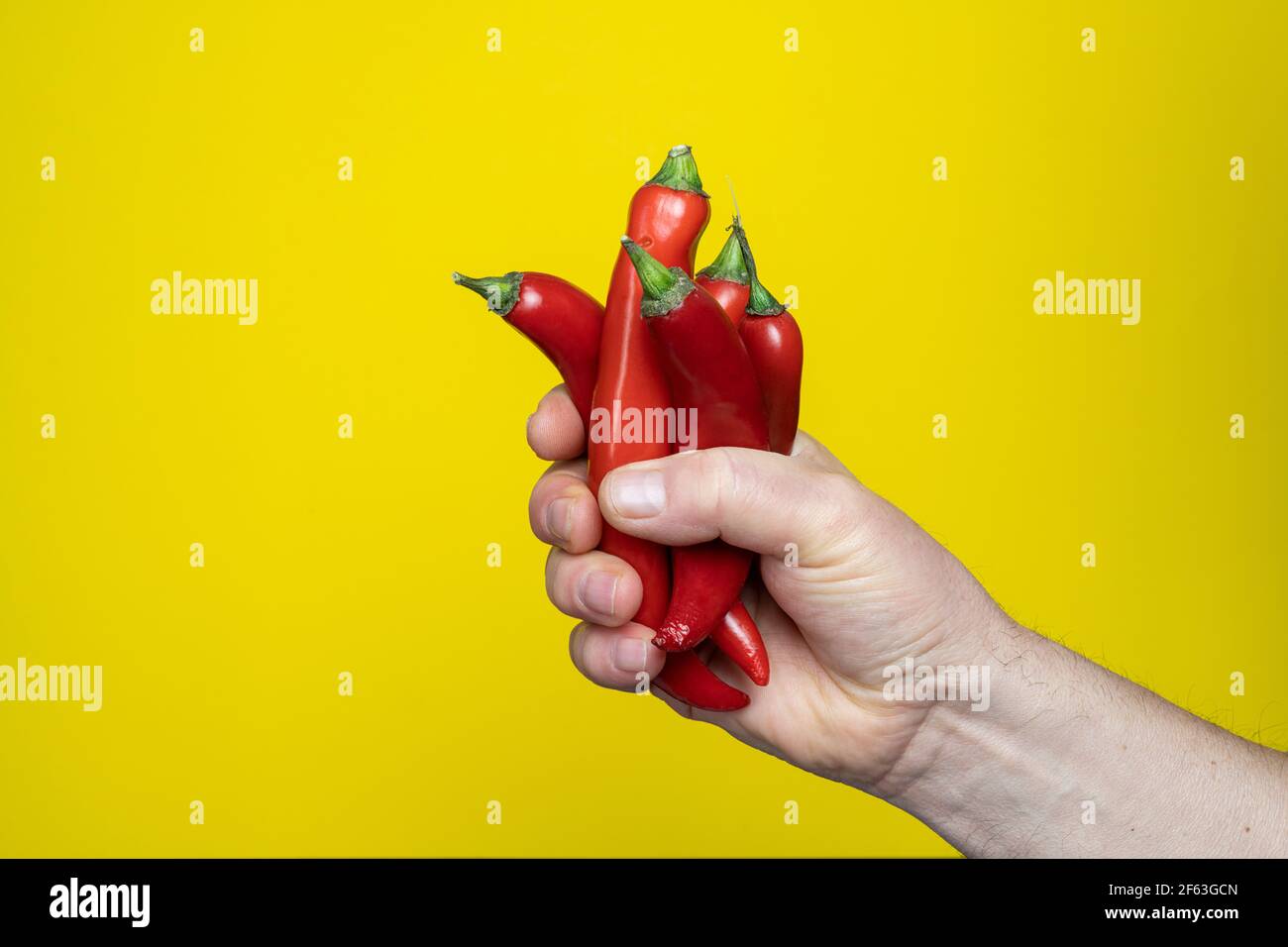 Some Red hot chili peppers in the hand Stock Photo - Alamy