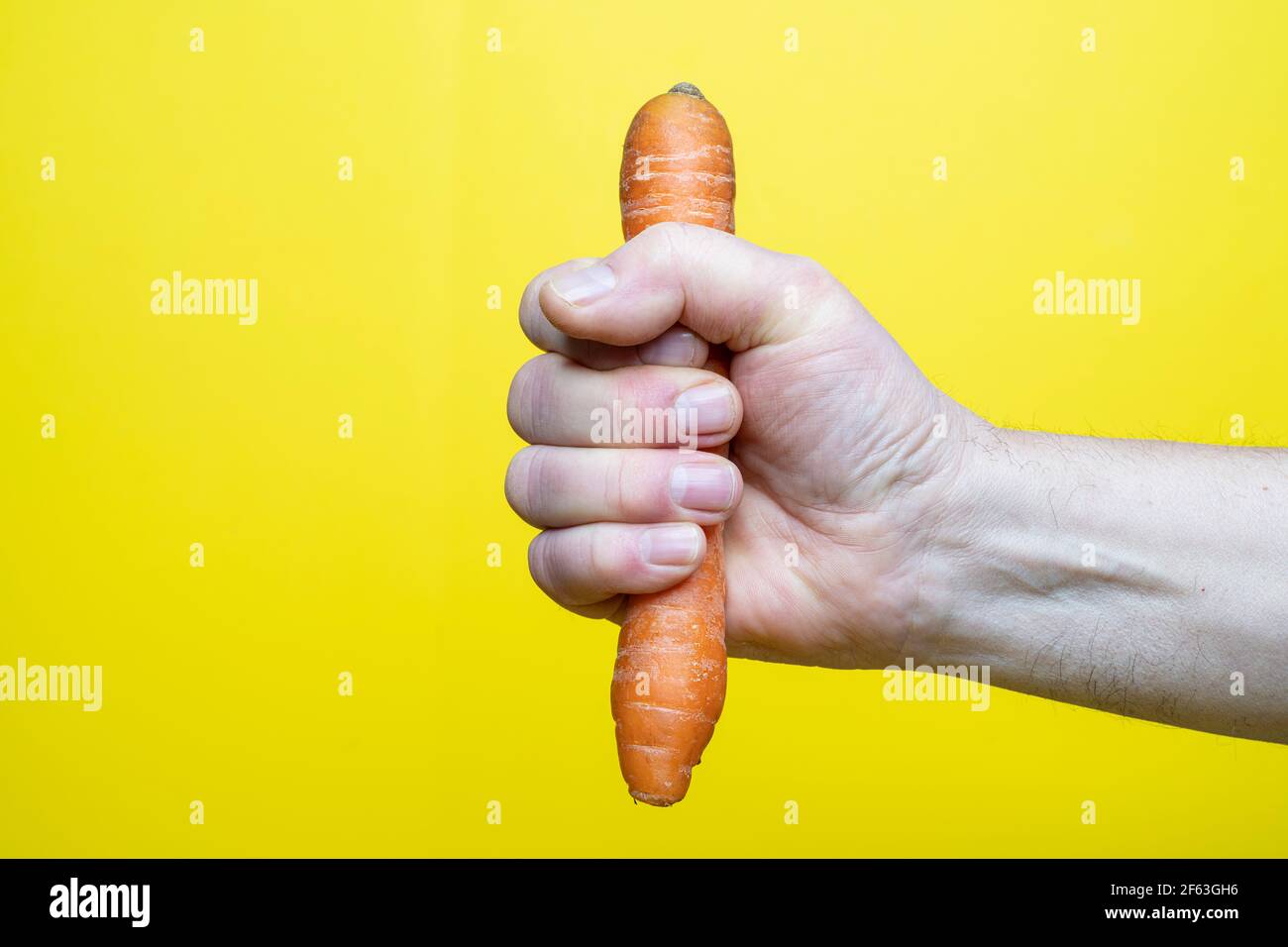 A carrot in the hand Stock Photo - Alamy