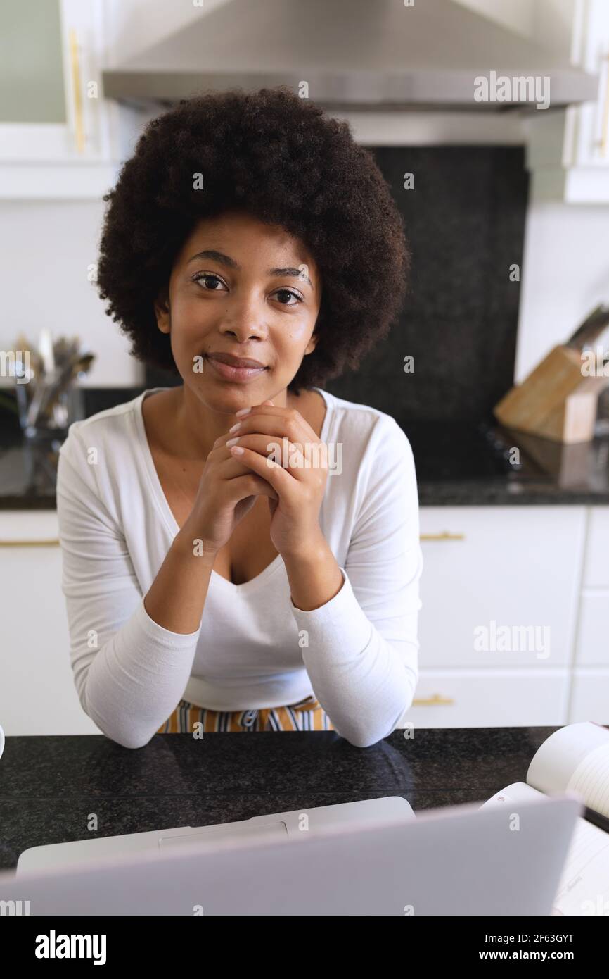 Woman sitting kitchen hi-res stock photography and images - Alamy