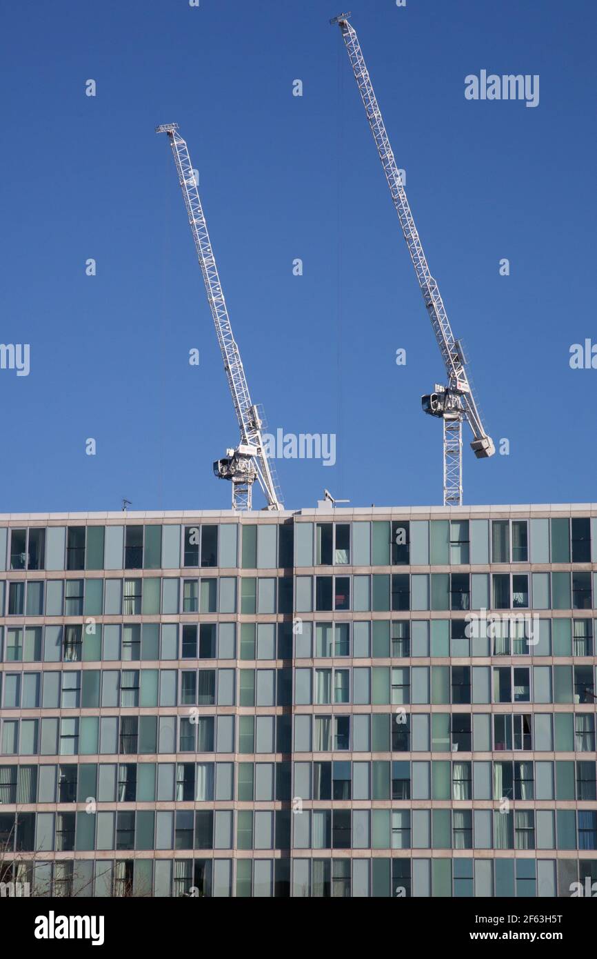 Two cranes working on a skyrise building on Avebury Boulevard in Milton ...