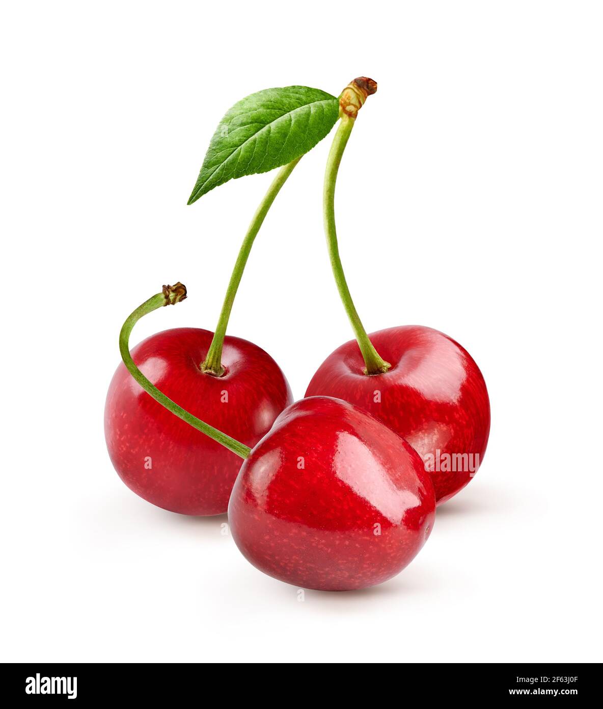 Three cherries with cherry leaf isolated on white Stock Photo - Alamy