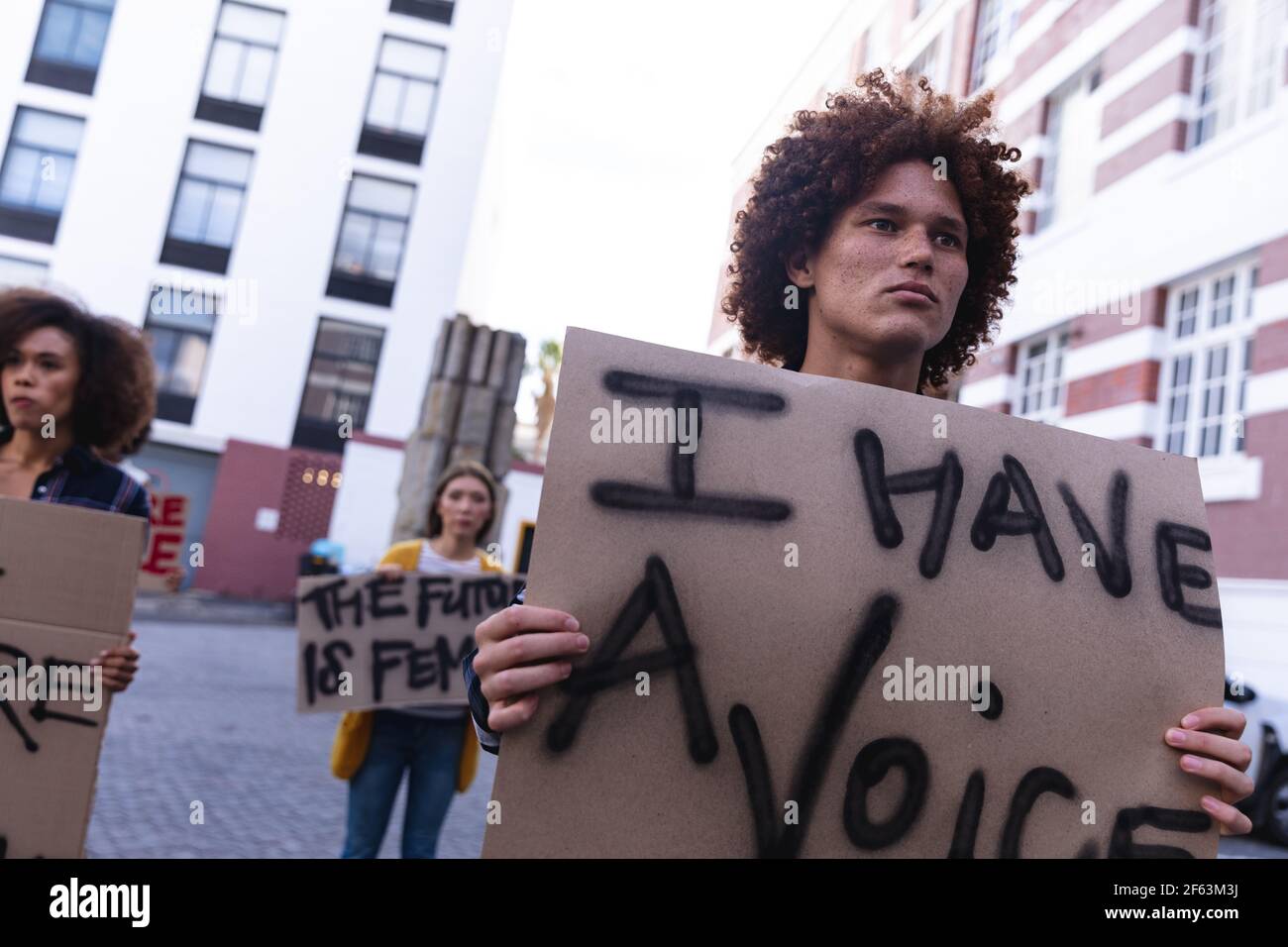 Holding protest sign hi-res stock photography and images - Alamy
