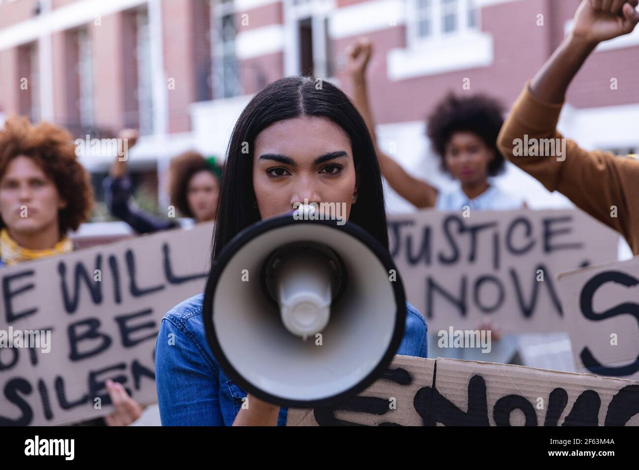 Woman holding megaphone and protest signs hi-res stock photography and ...