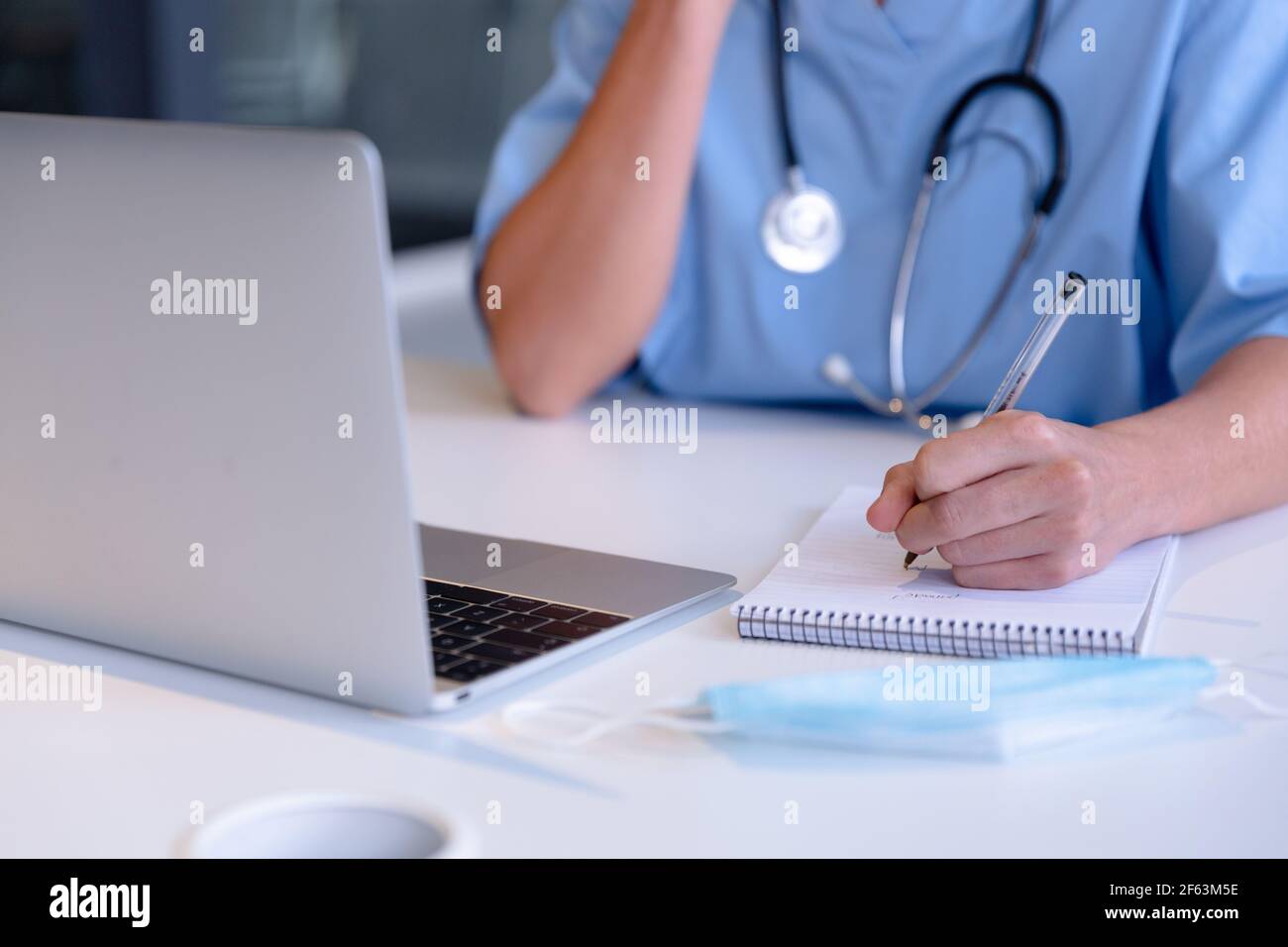 Doctor taking notes telehealth hi-res stock photography and images - Alamy