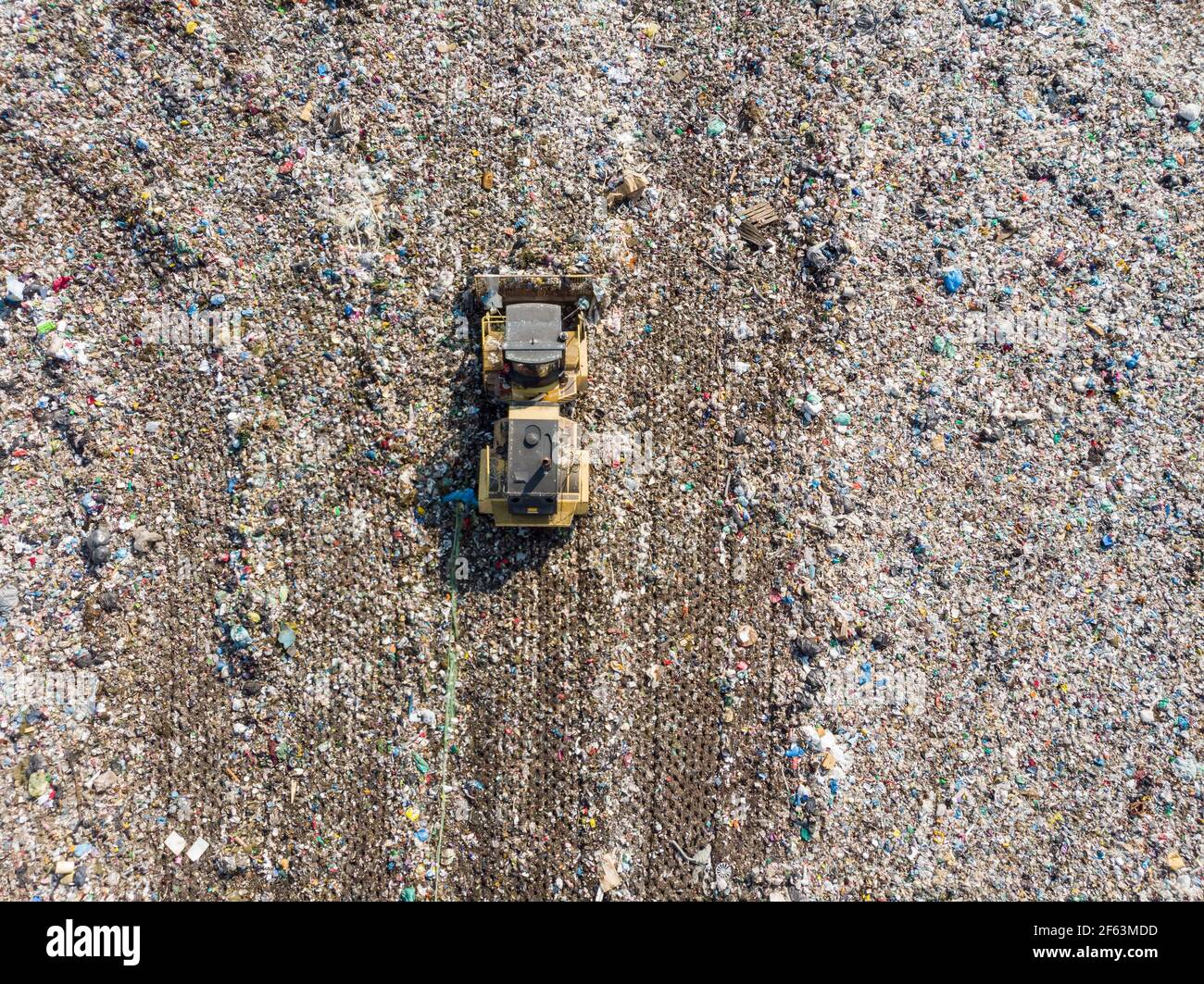 Garbage trucks unload garbage to a landfill Stock Photo - Alamy