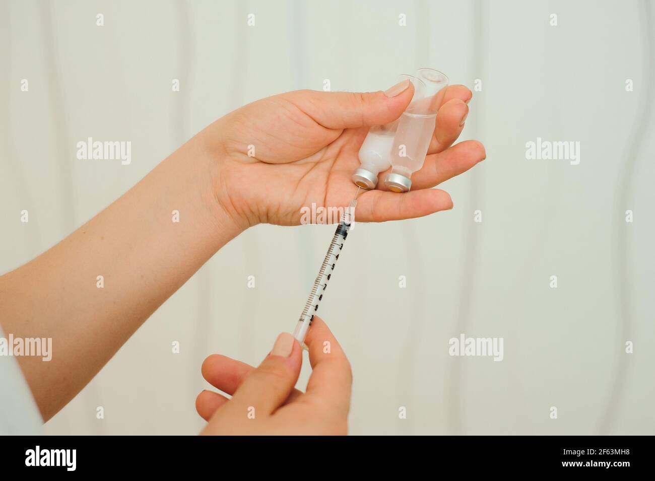 Syringe, medical injection in hand, palm or fingers. Medicine plastic ...