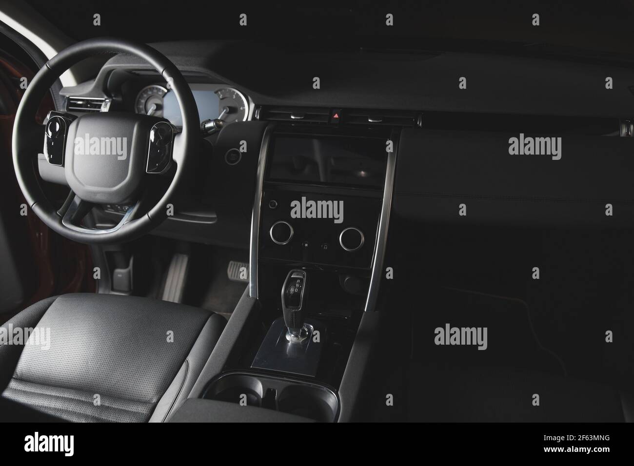Luxury car inside, automatic gear stick of a modern car. Dark leather ...