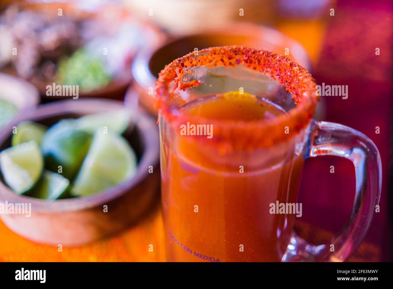 Traditional Mexican michelada in glass mug with blurry background Stock ...