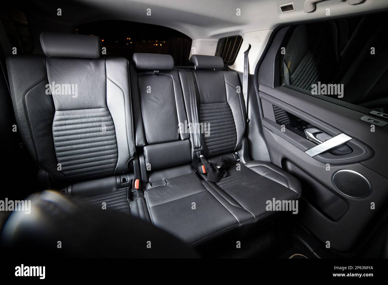 Dark luxury new car Interior. Back passenger seats in modern car ...