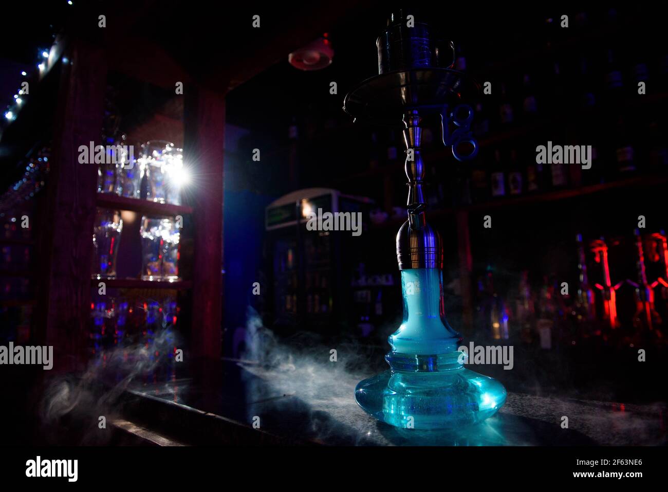 Hookah on the background of a bar, light, smoke, smog Stock Photo - Alamy