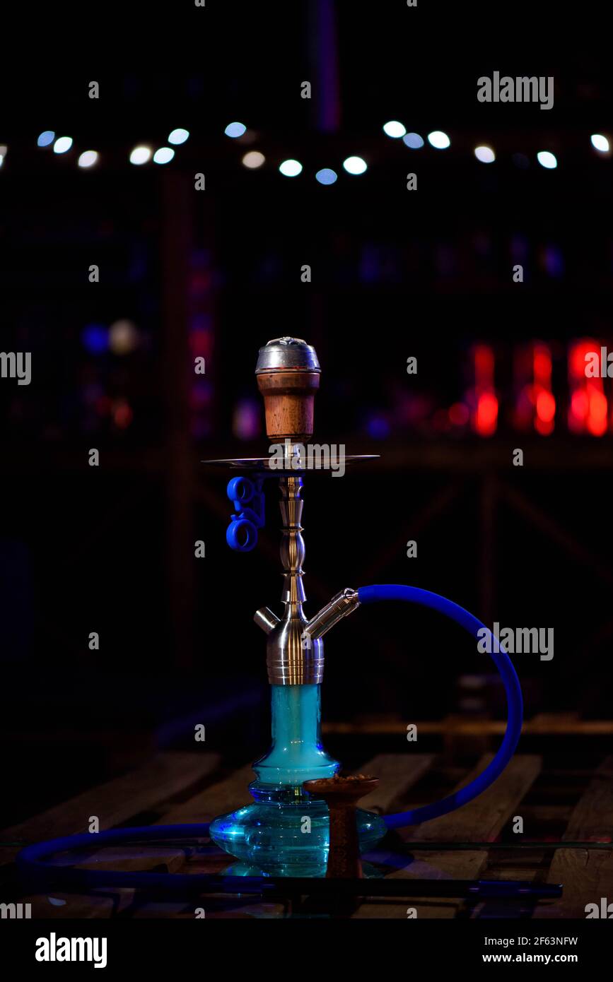 Hookah on the background of a bar, light, smoke, smog Stock Photo - Alamy
