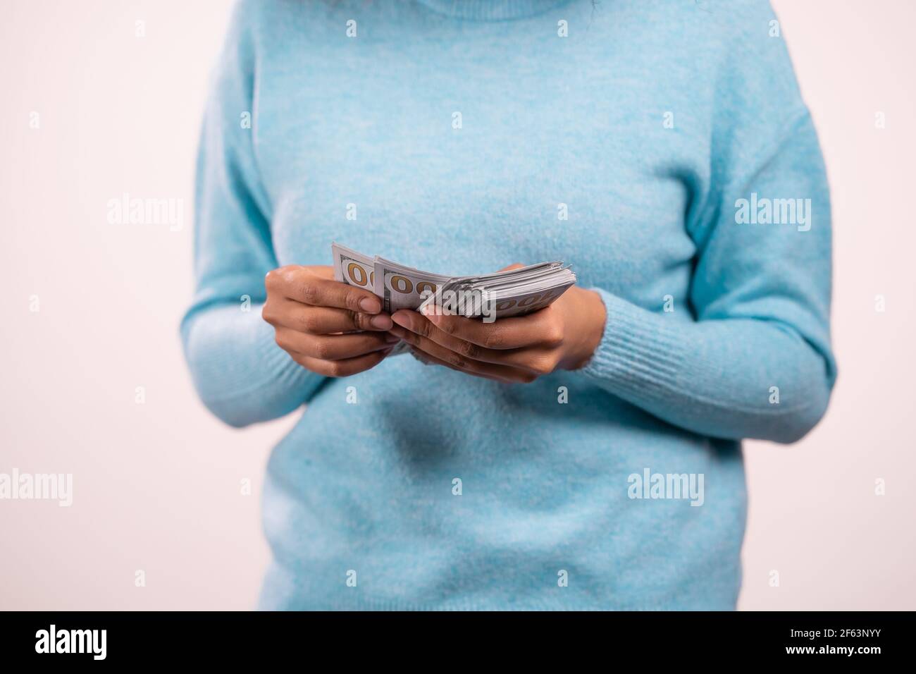 Hands of woman counting USD currency. Lady counts money - dollars ...