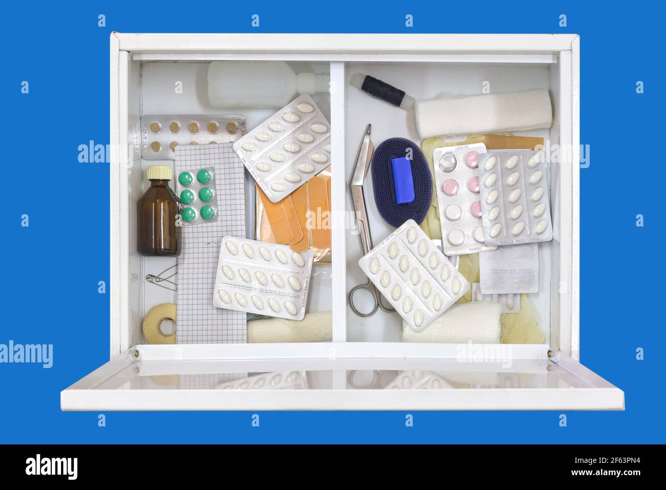 Preparation of a home first aid kit with pills and medical instruments ...