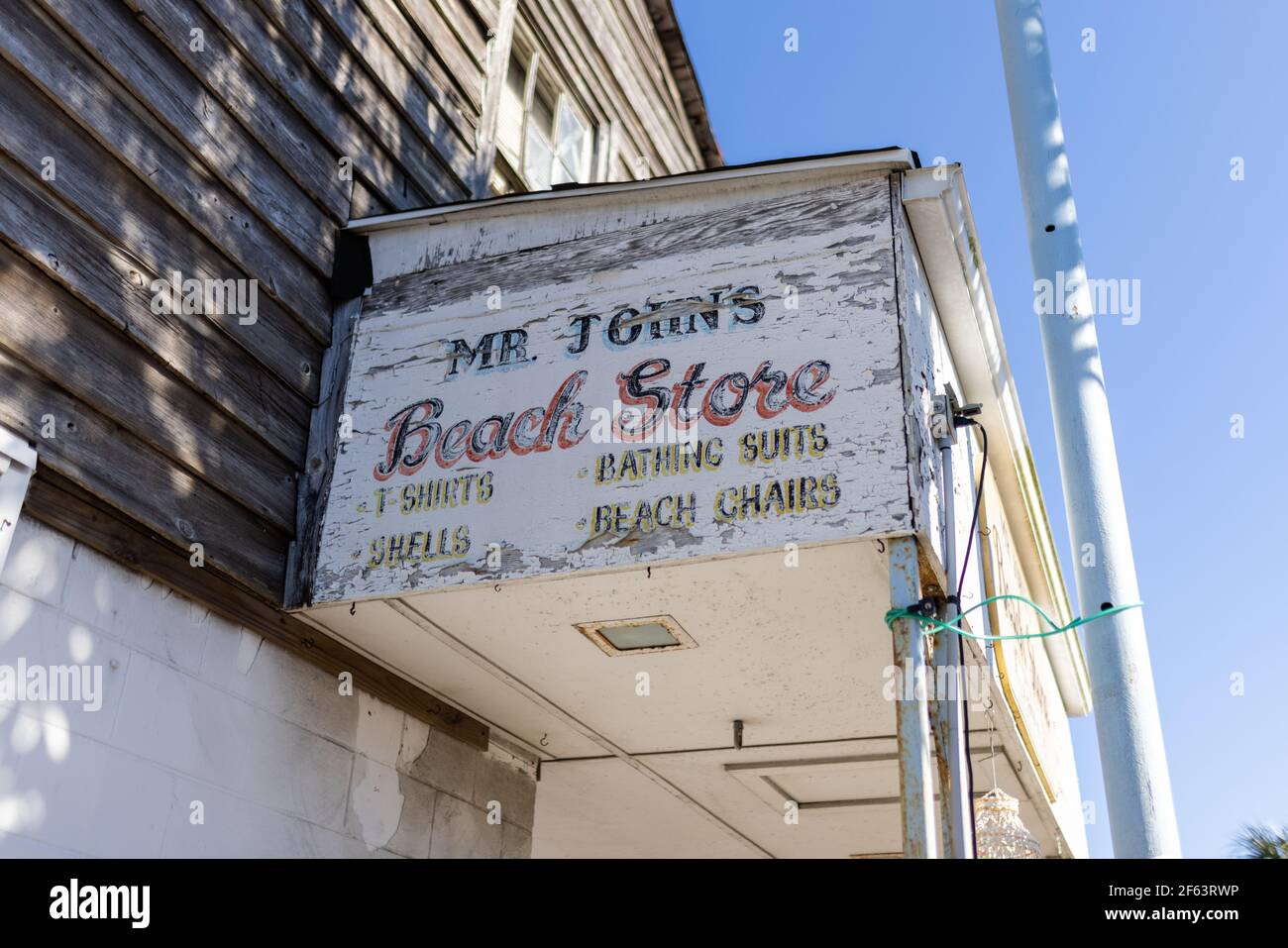 Old beach store signboard on building with wooden walls Stock Photo - Alamy
