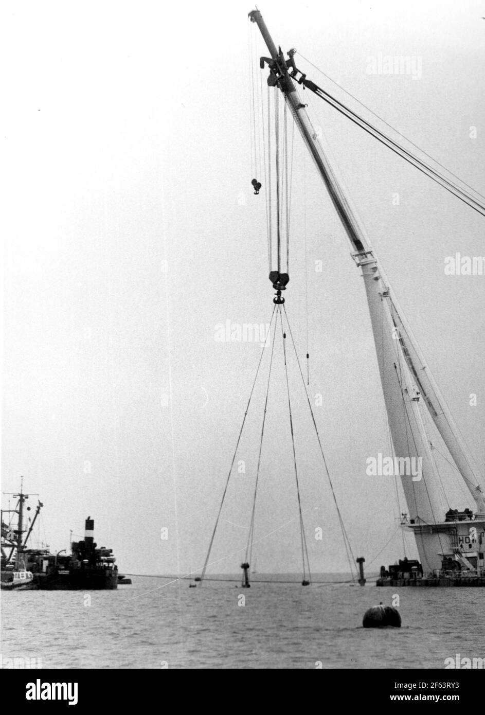 LIFTING FRAME BREAKS THE SURFACE AS THE CRANE TOG MOR BEGINS TO RAISE ...