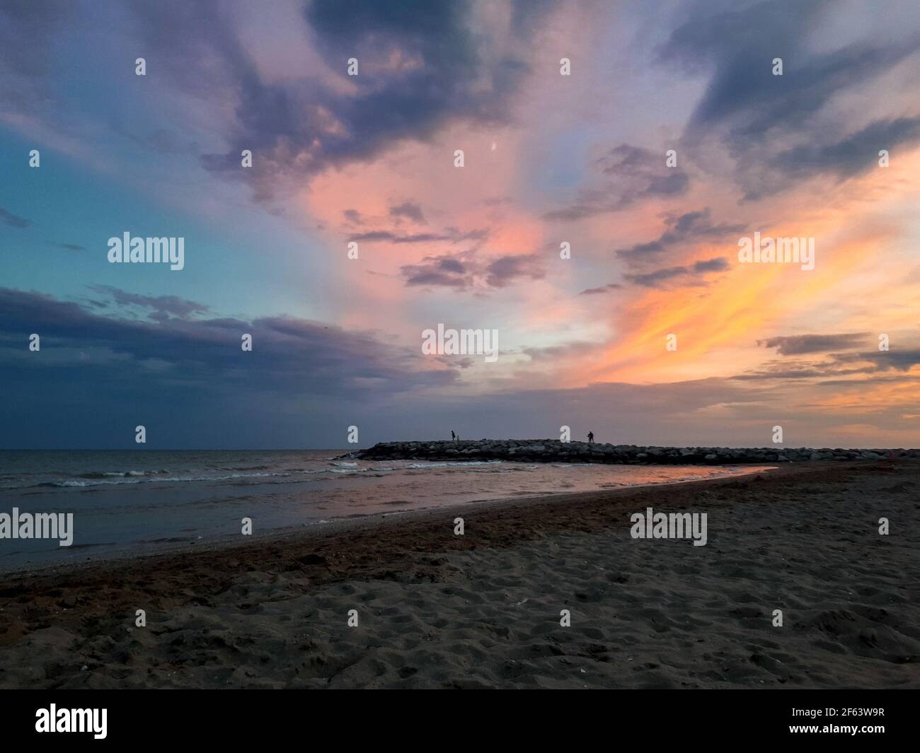 Colorful sunset at the adriatic sea on the beach in Italy. Sunset sky ...