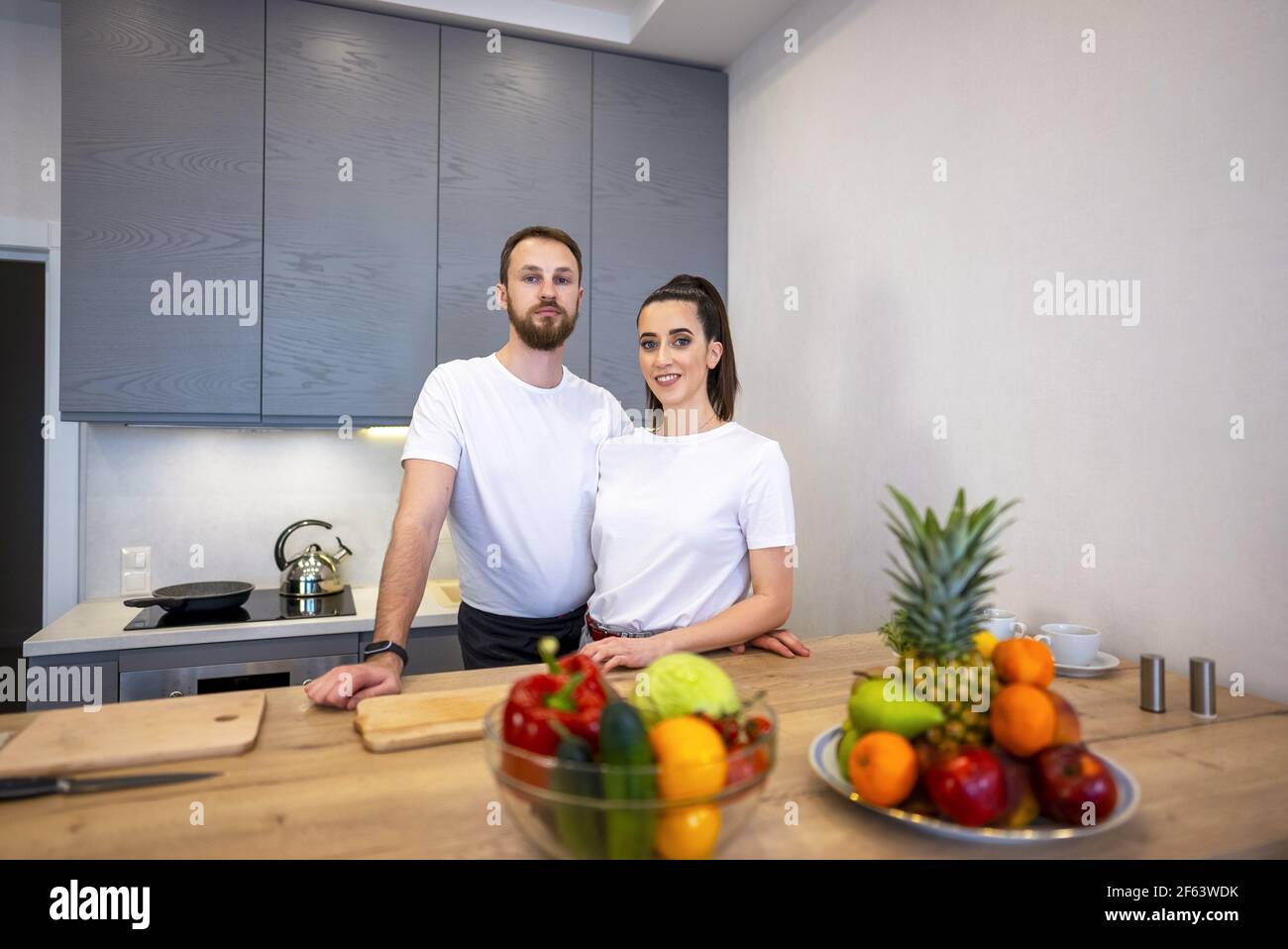 Couple Together In The Kitchen With Fruit And Vegetables Stock Photo ...