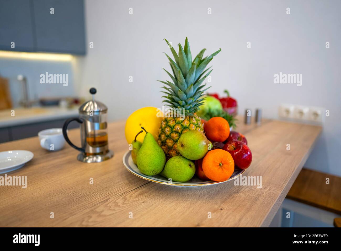 Fruits And Vegetables On The Table Of Modern Kitchen Stock Photo - Alamy