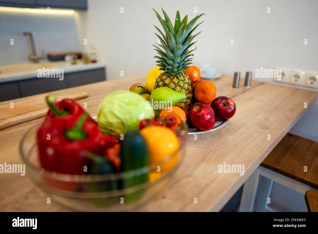 Fruits And Vegetables On The Table Of Modern Kitchen Stock Photo - Alamy