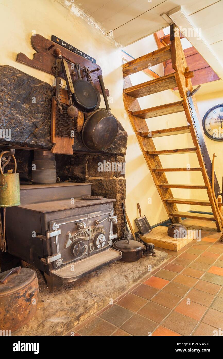 Marksman cast iron wood-burning stove in granite fireplace in dining ...