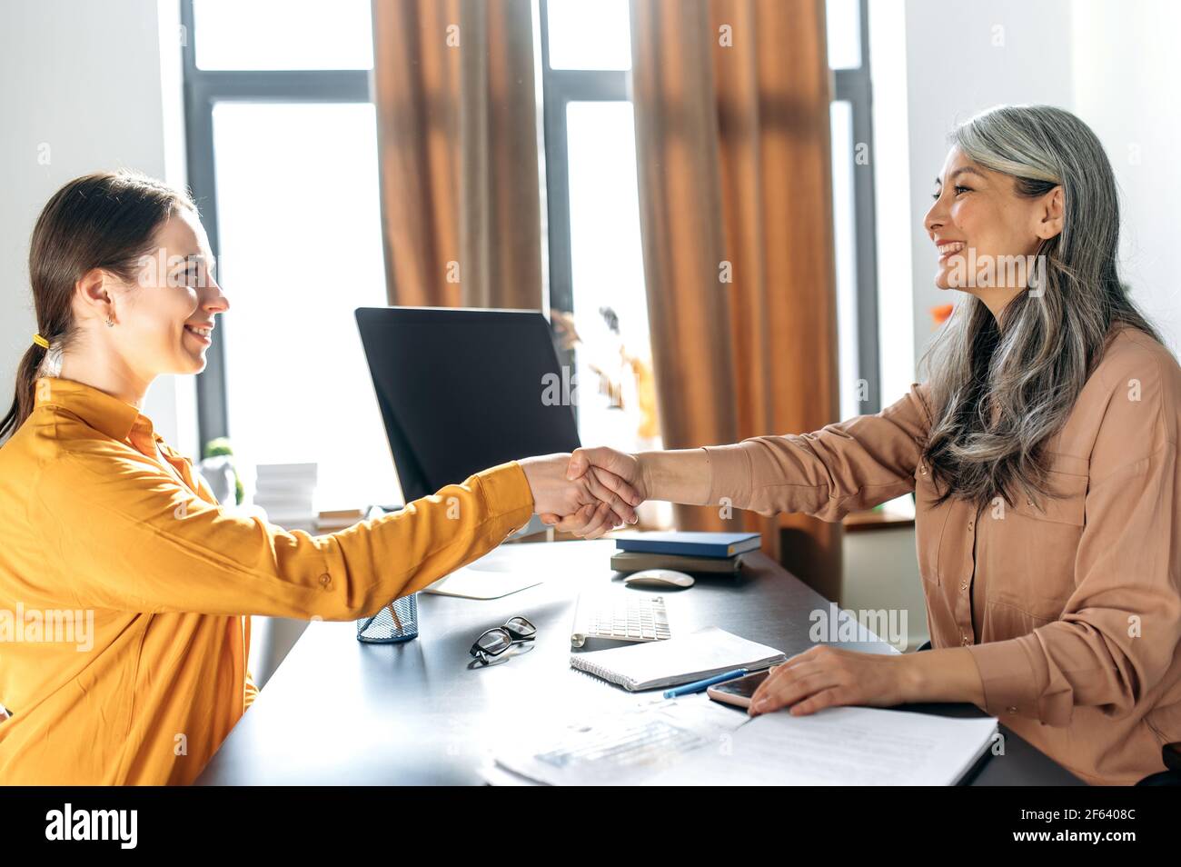 Influential successful gray-haired senior Asian woman, business woman ...