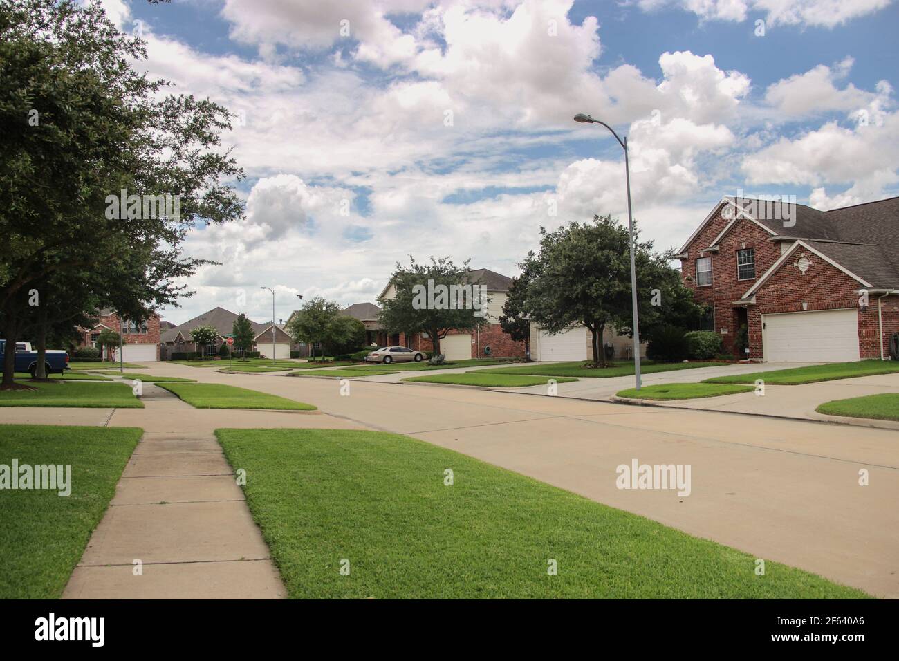 American suburbs. Random street in the neighborhood on a cloudy day ...