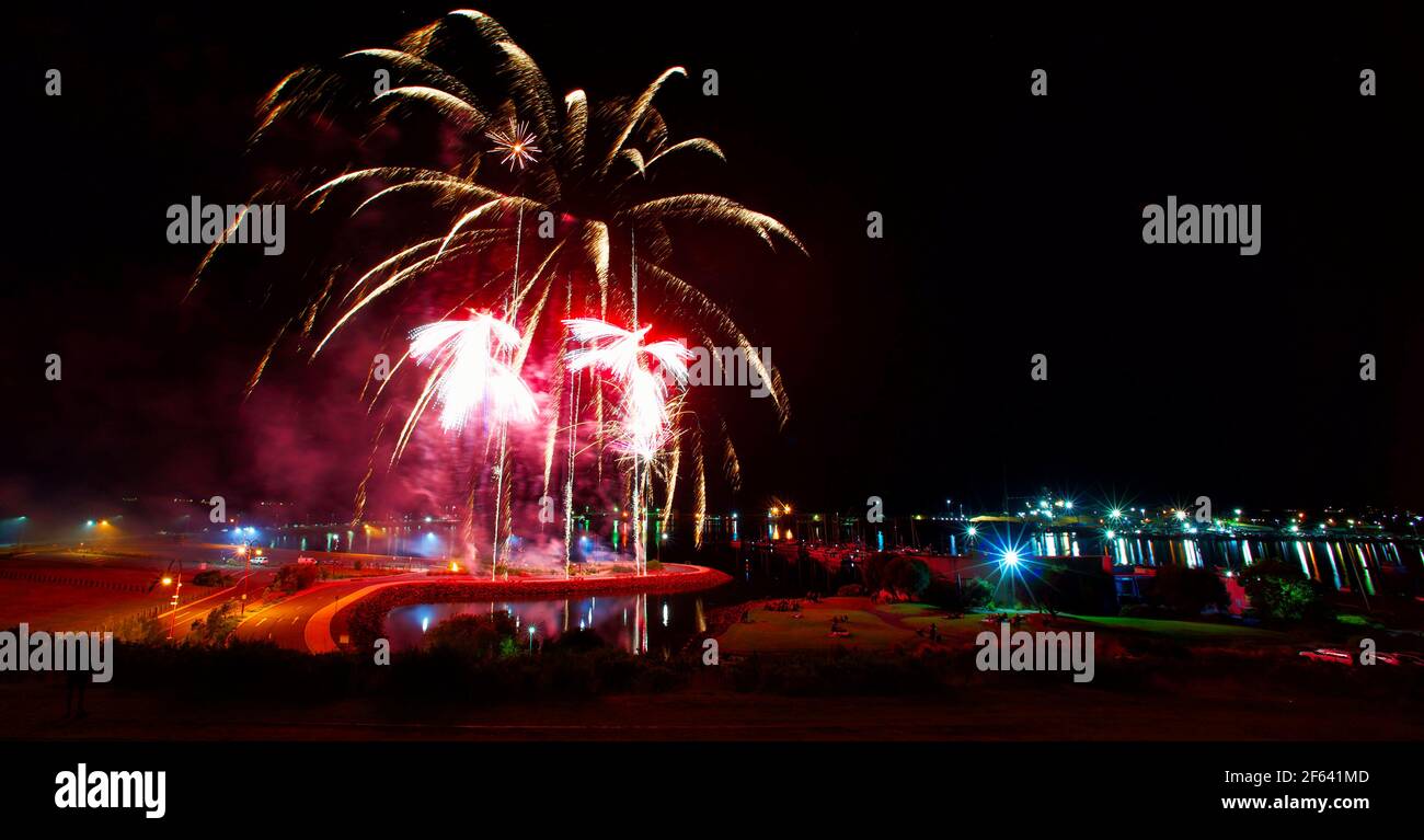 Fireworks over water Stock Photo - Alamy