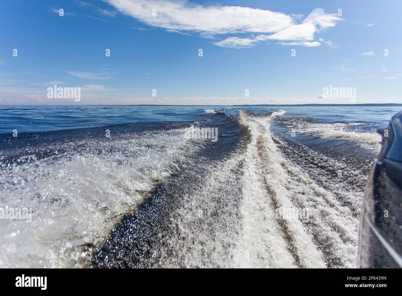 Trace on the water from a motor boat with splashes of water Stock Photo ...
