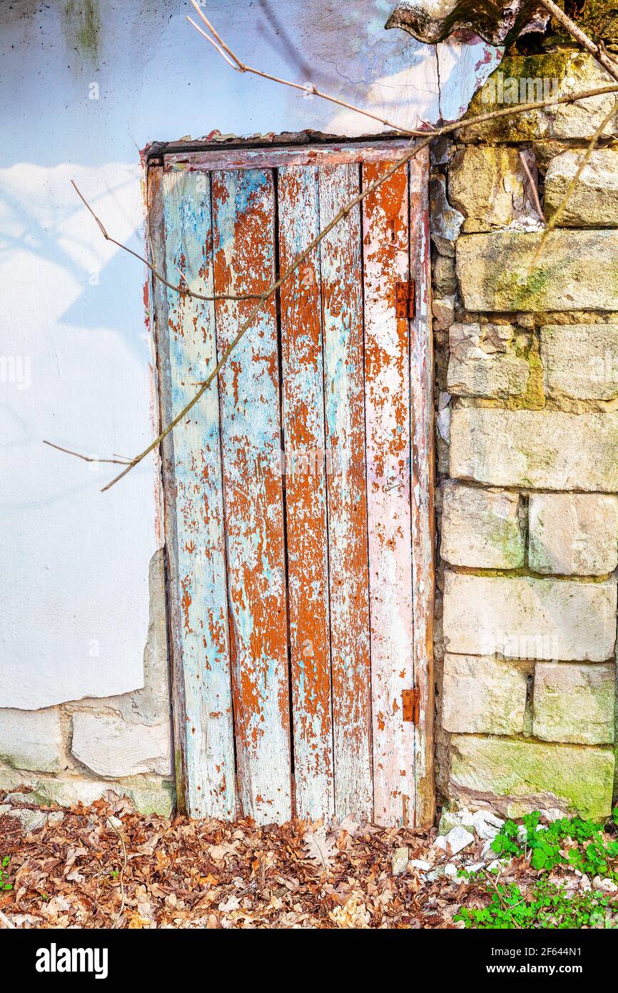 Wooden door part of demolition brick wall Stock Photo - Alamy