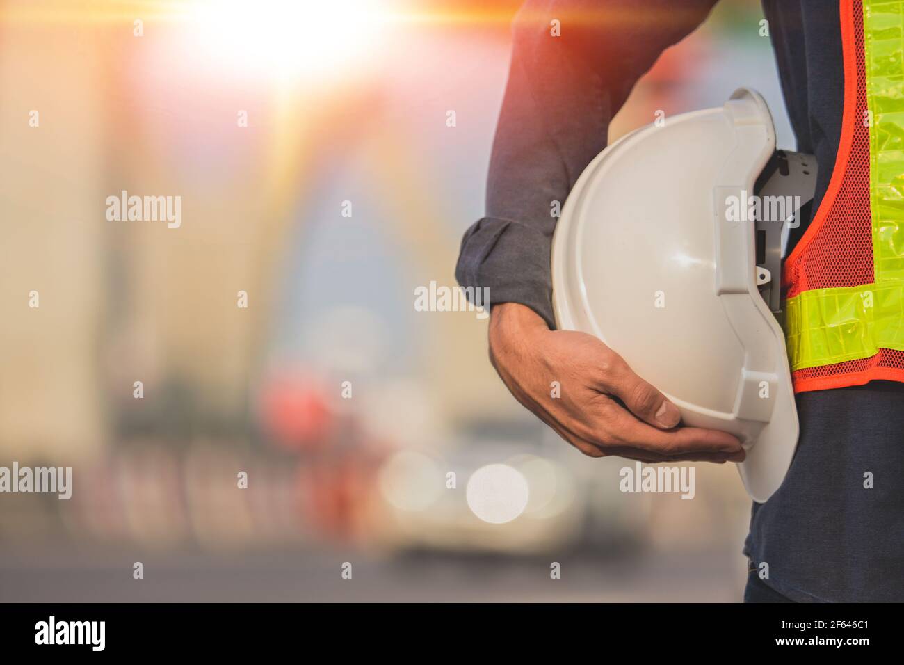 Engineer holding helmet on site Road construction For the development ...