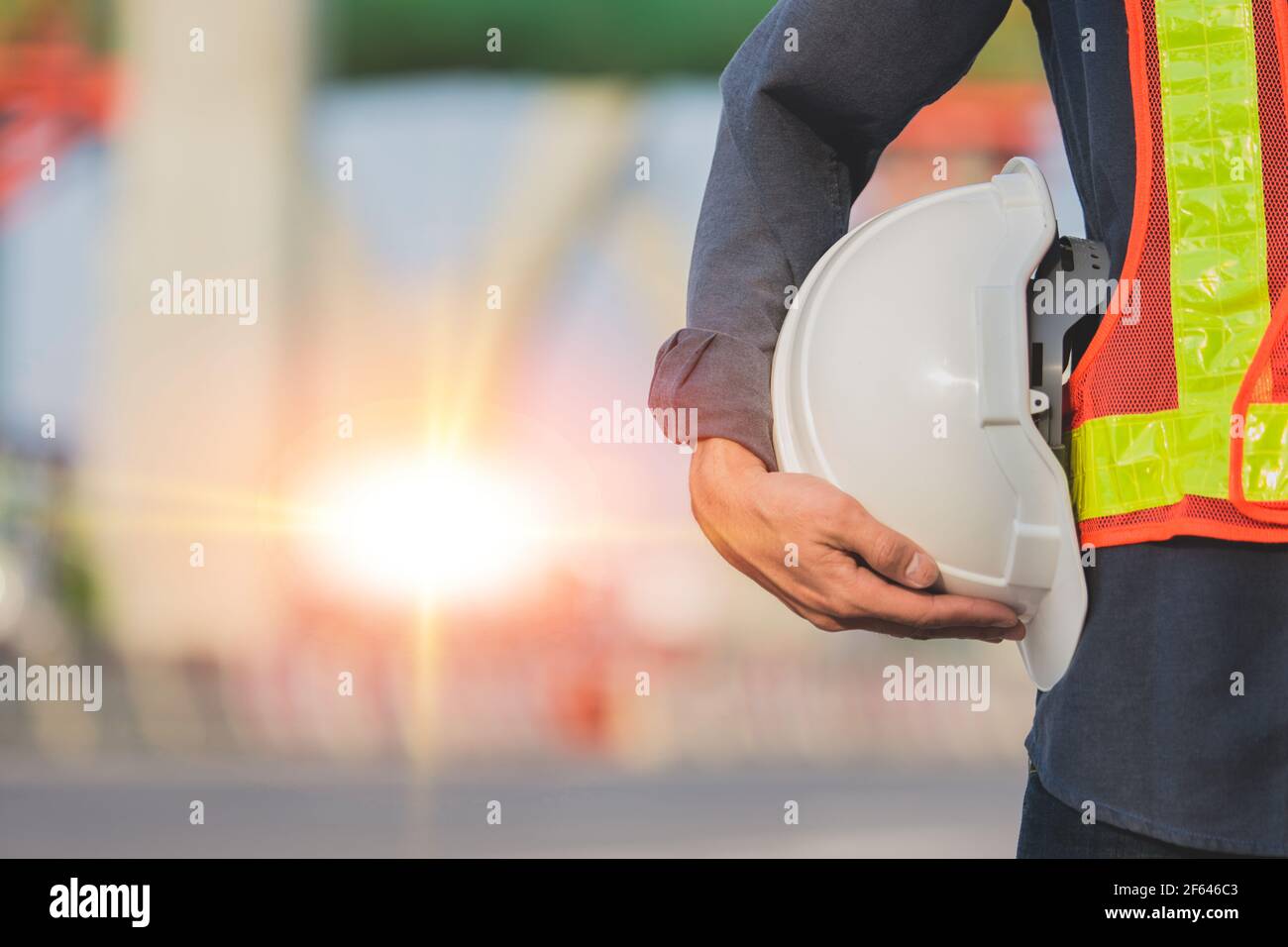 Engineer holding helmet on site Road construction For the development ...