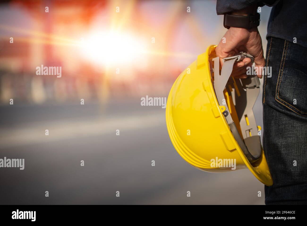 Engineer holding helmet on site Road construction For the development ...