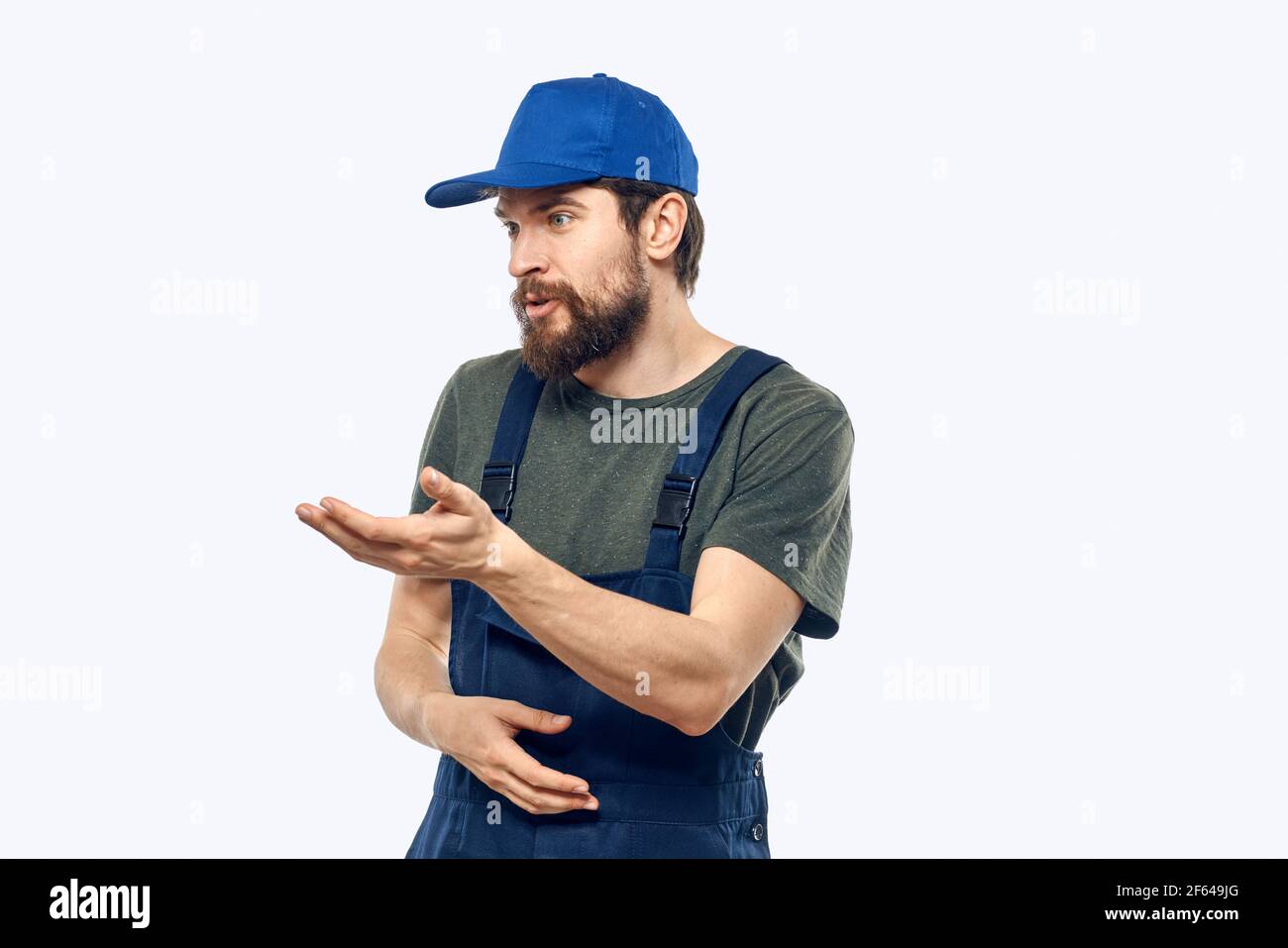 man in work uniform blue cap service work professional Stock Photo - Alamy