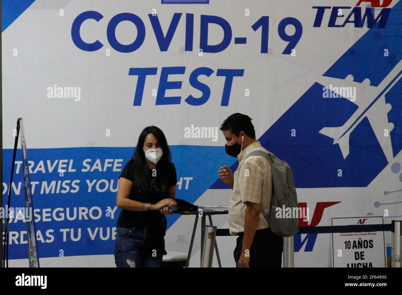 Passengers wearing protective mask are seen at a covid19 certified PCR ...