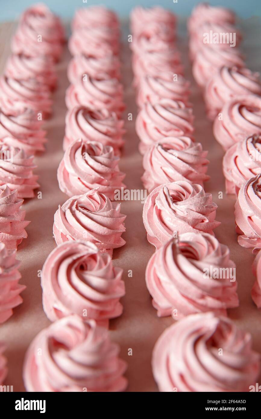 Handmade pink marshmallows on parchment background. Marshmallow ...