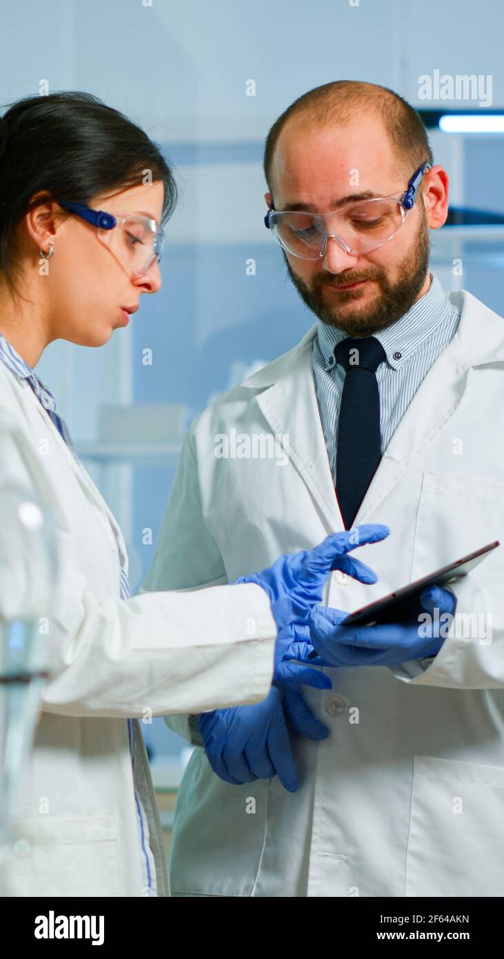 Scientist team meeting discusssing treatment hi-res stock photography ...
