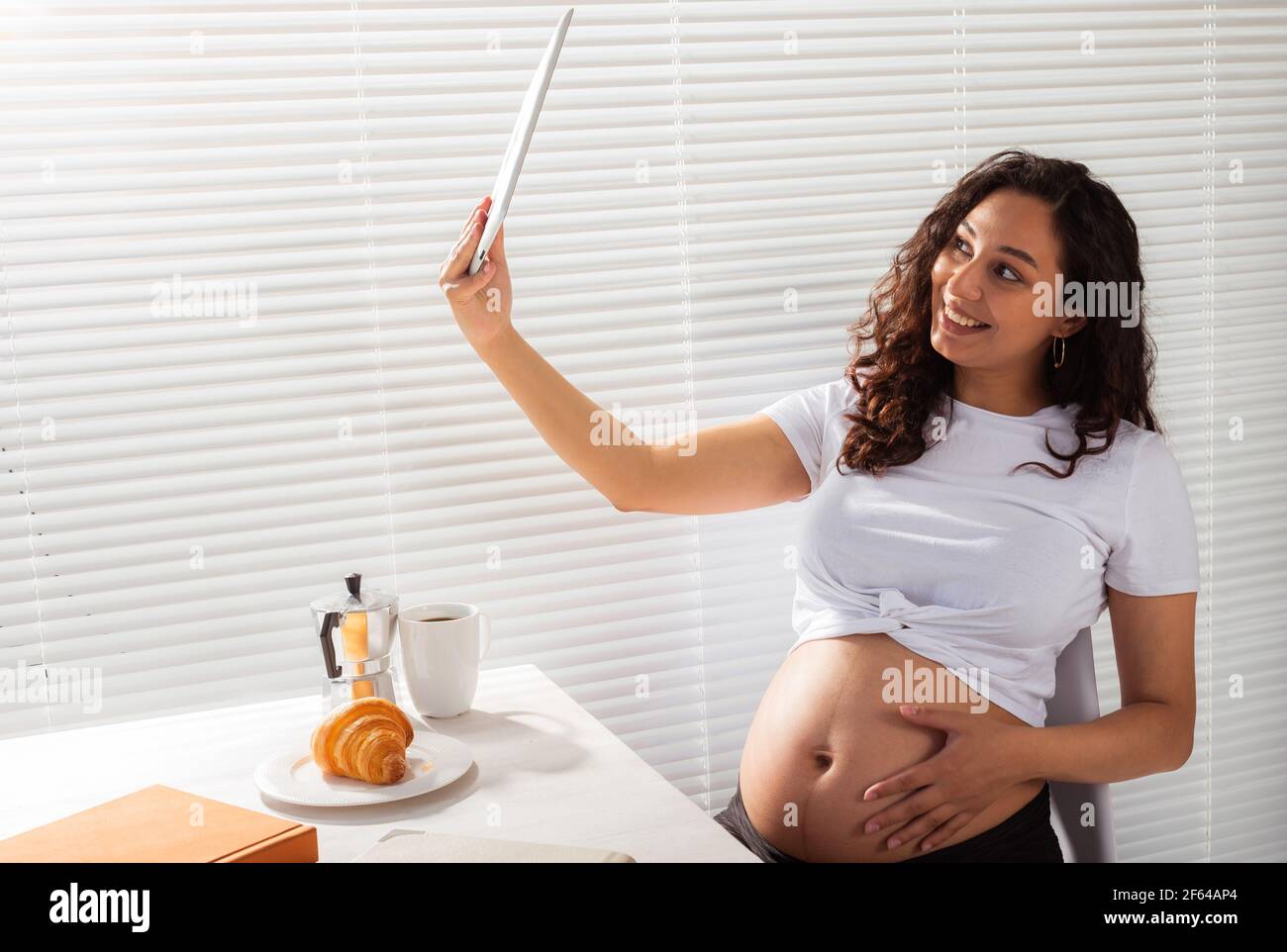 Stomach talking brunette looking hi-res stock photography and images ...