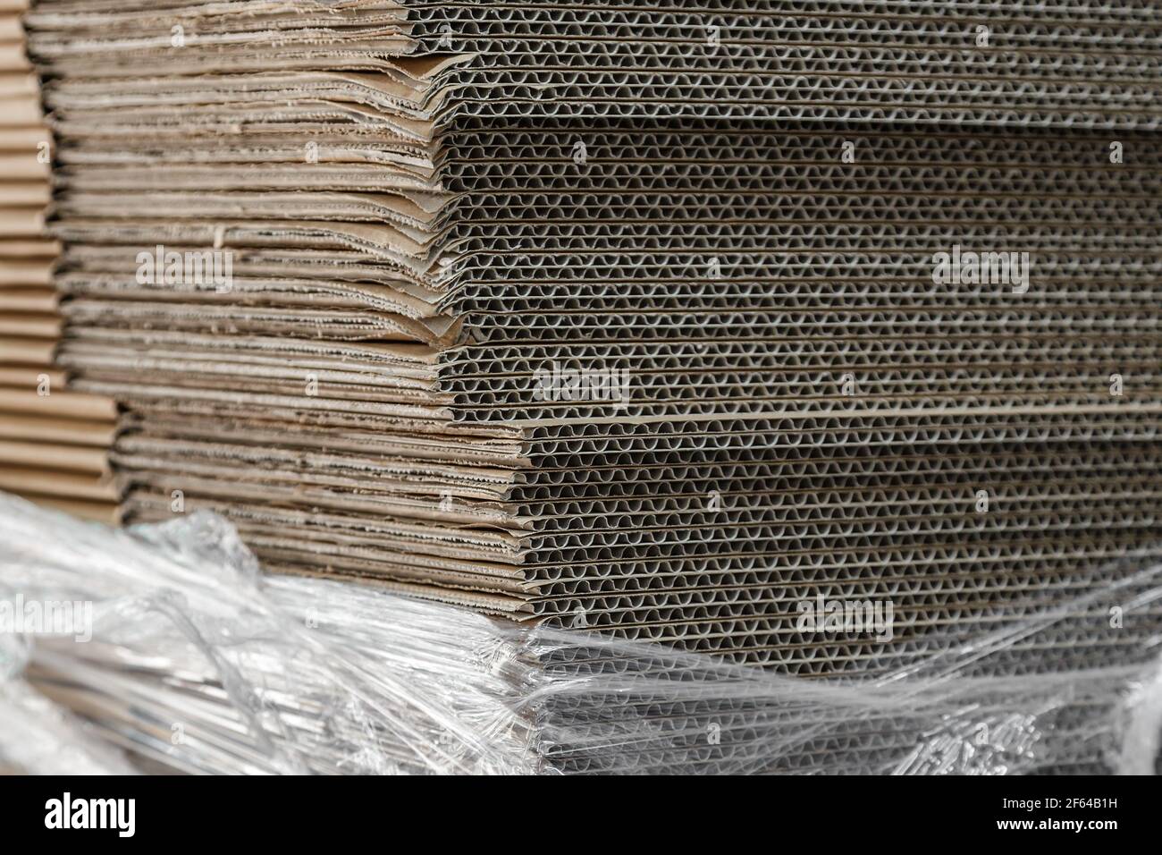 Close-up of new folded cardboard boxes, ready for packaging goods and ...