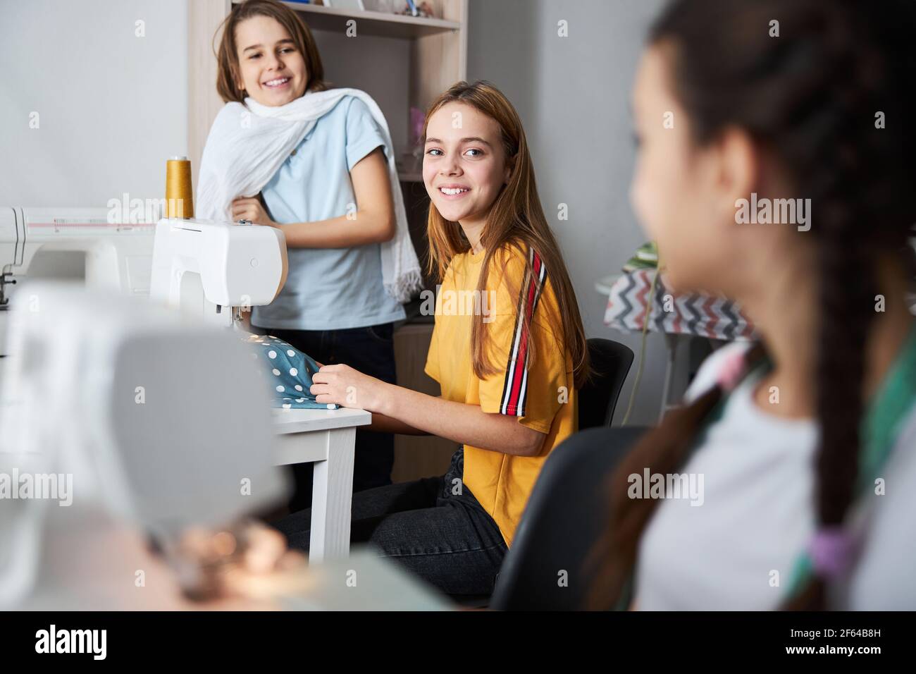 Girls sewing hi-res stock photography and images - Alamy