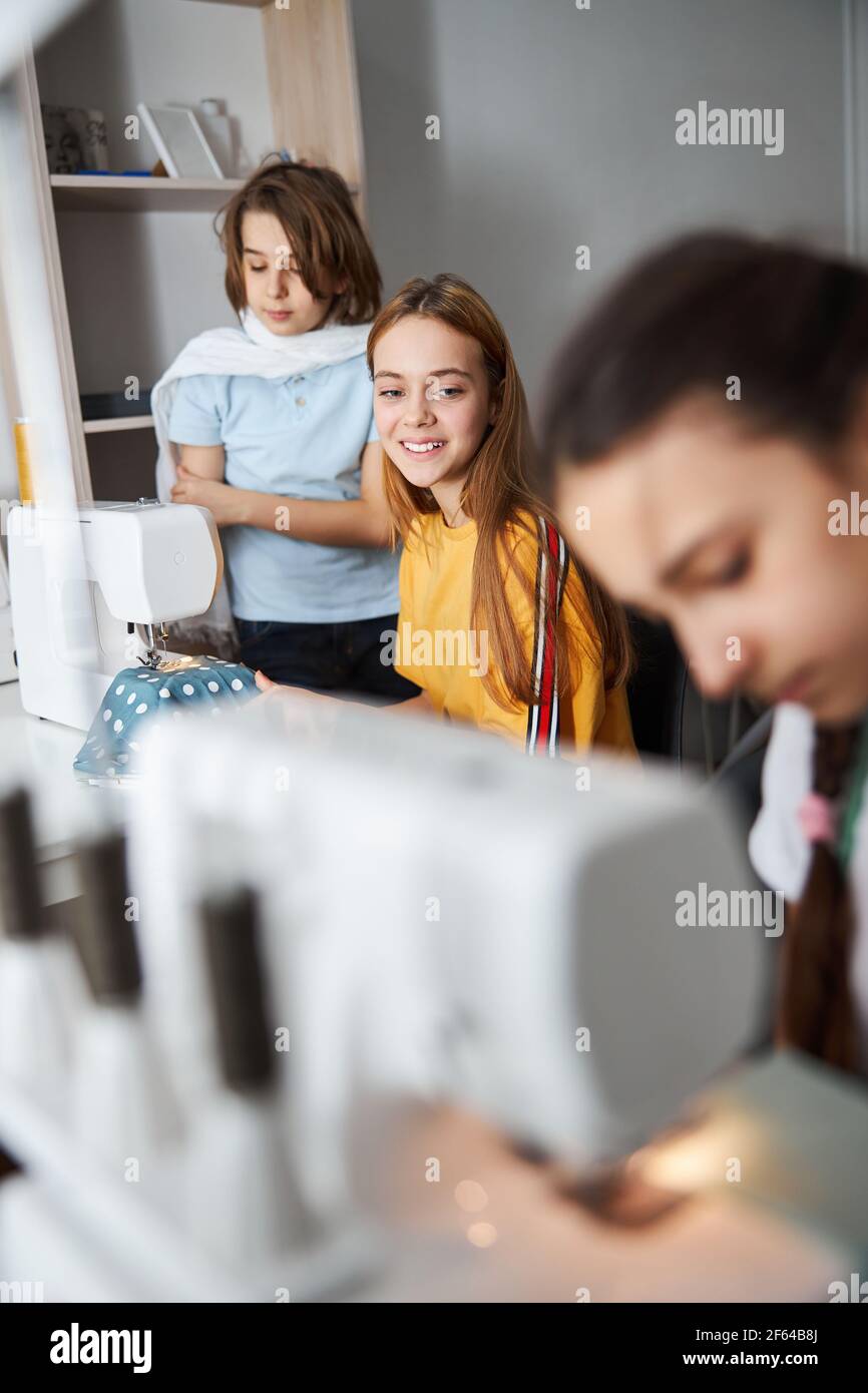 Girls sewing hi-res stock photography and images - Alamy