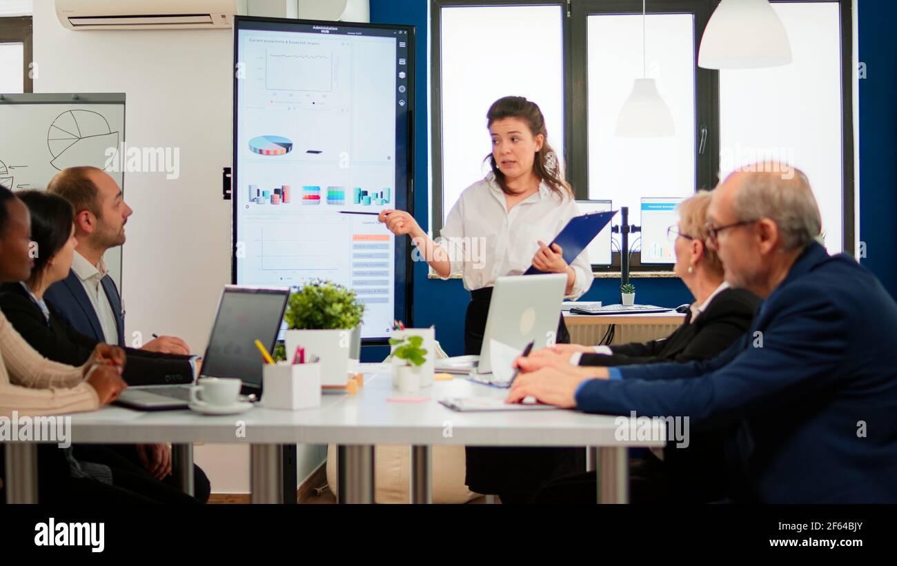 Female executive leader coach presenter giving financial presentation ...