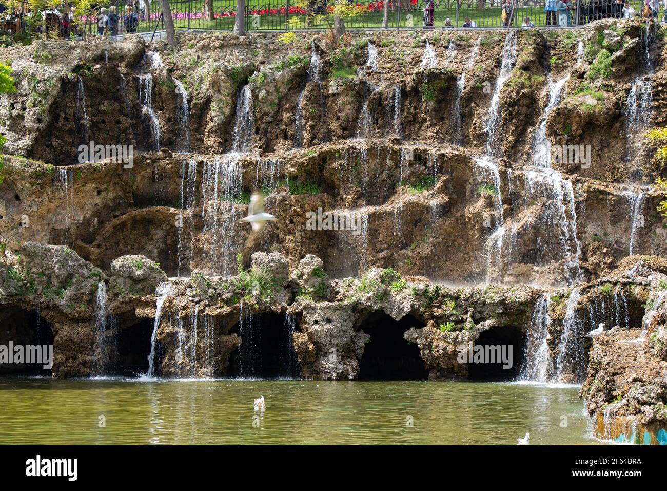 Small rocky waterfall pouring into a small pool Stock Photo - Alamy