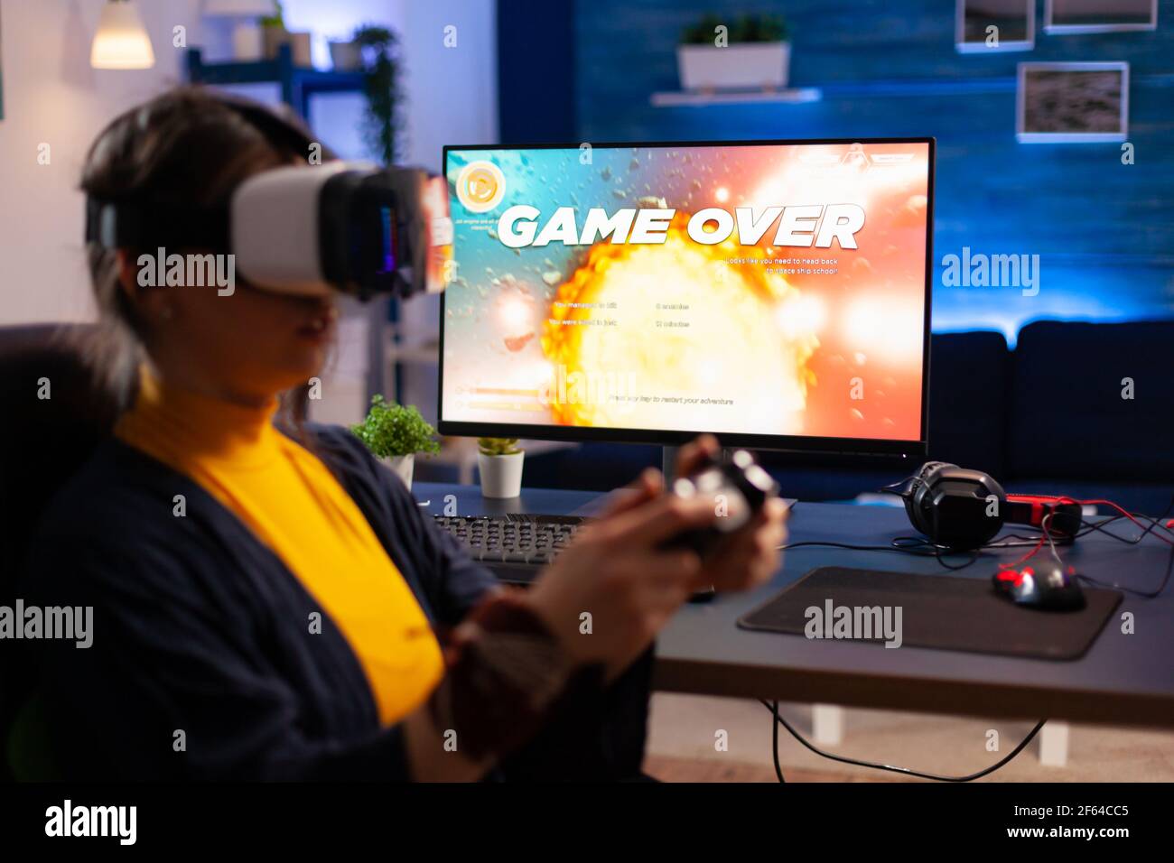 Game over for cyber gamer playing space shooter game using professional ...